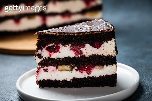 Chocolate cake with raspberry on plate. Slice of cake. Raspberry cake ...