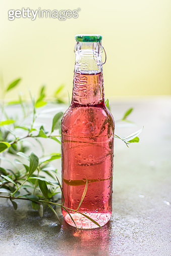 Kaliningrad, Russia - June, 2021 – Cold pink lemonade in bottle, green ...