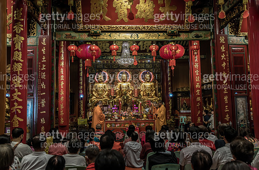 Chinese monks chanting mantras and doing rituals for buddhism worship ...