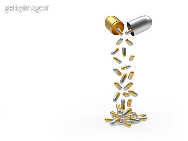 Gold and silver pills pouring out of an open medical capsule 이미지 ...