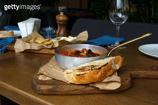 Delicious hearty lunch at a fish restaurant. Tuscan tomato soup with ...