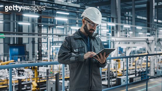 Portrait of Automotive Industry Engineer in Safety Glasses and Uniform ...