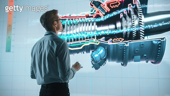 Innovative Green Energy Startup: Engineer Designing Engine Using Tablet ...