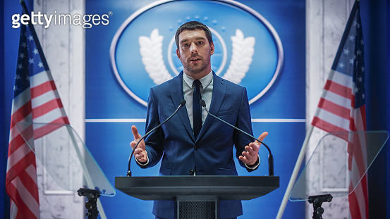 Young Organization Representative Greeting Supporters at a Government ...