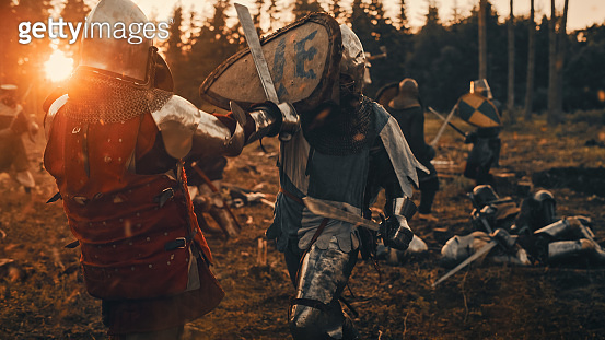 Medieval Knight Walking on Battlefield amidst Dead Enemies. Last ...