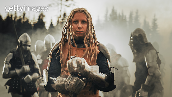 Epic Battlefield: Portrait of Powerful Female Leader Warrior Holding ...