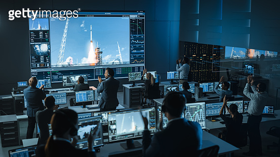 Group of People in Mission Control Center Witness Successful Space ...