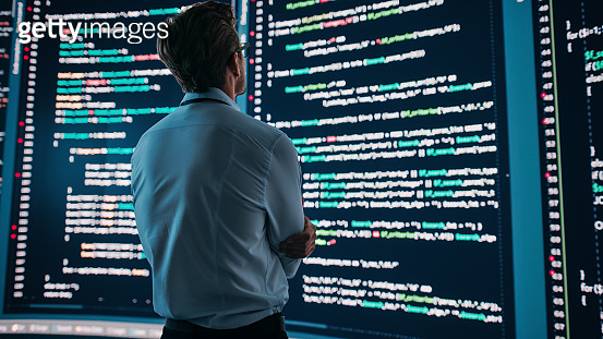 Innovative Computer Science Concept: Software Engineer Standing and Doing Information Technology ...