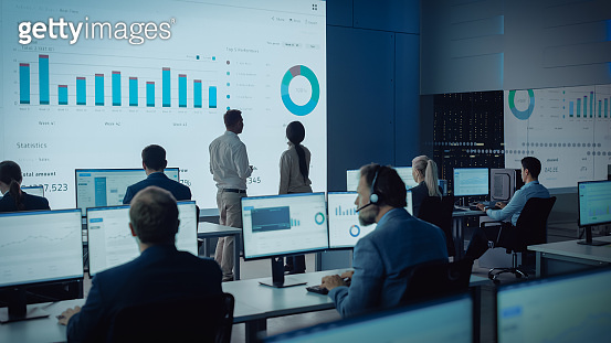 Two Traders Having a Meeting in a Modern Monitoring Office with ...