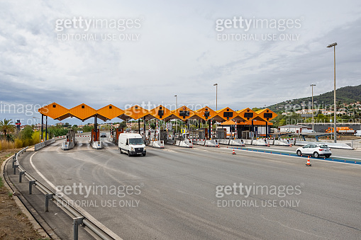 Toll gate on the C-32 Highway , cars passing through the checkpoint ...