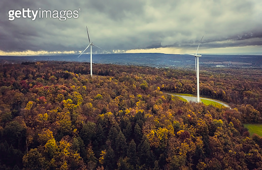 Wind turbines on the top of Vermont mountains, aerial view, fall season ...