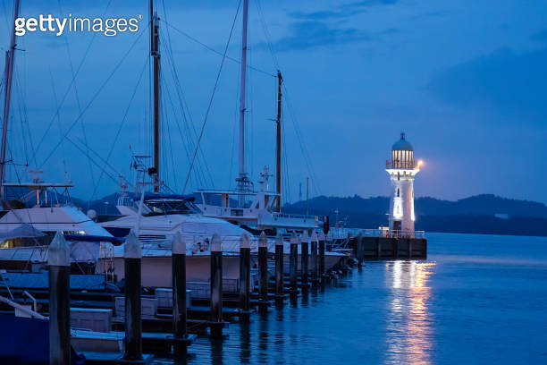 Yachts before Raffles Marina lighthouse in Tuas, Singapore 이미지 ...