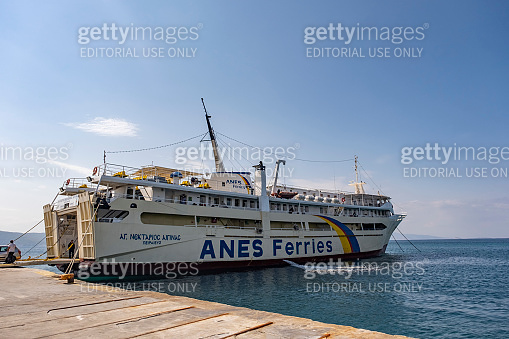 Side view on ANES FERRIES ship moored at Aegina Island waiting for ...