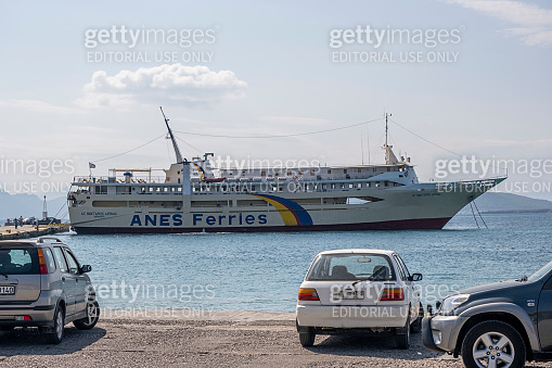 Side view on ANES FERRIES ship moored at Aegina Island, cars parking at ...