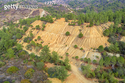 Restoration of former open pit Evloimeni copper mine, Cyprus. Forest ...