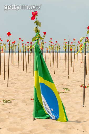 Brazil flag with roses in the background on Copacabana beach in Rio de ...