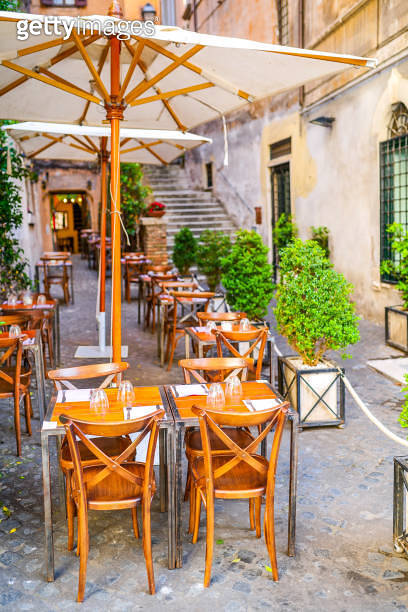 A charming Italian cuisine tavern along a stone alley in the Piazza ...