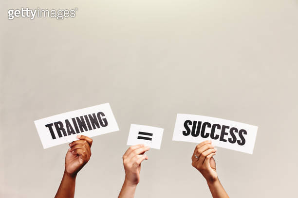 Hands holding up signs reading Training Equals Success (1293783454 ...