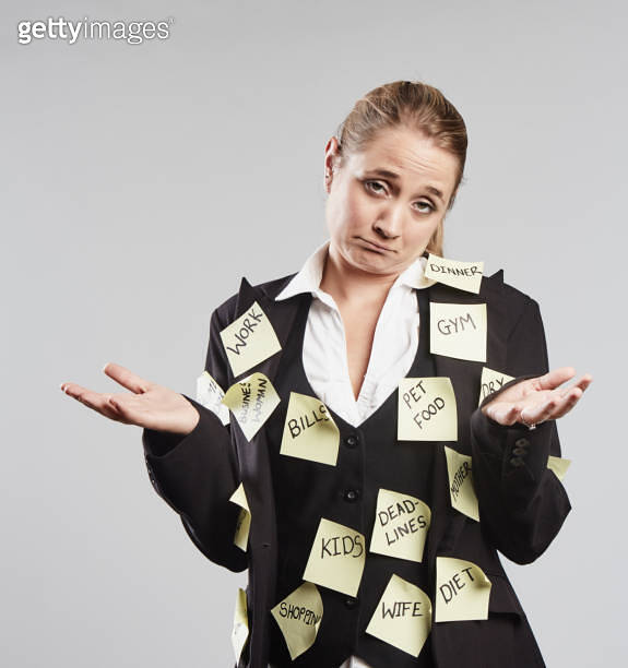 Woman covered in sticky notes shrugs about all the demands placed upon ...