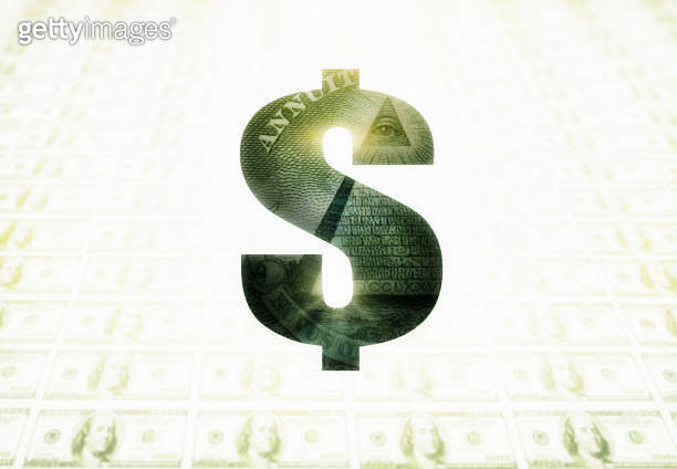 US $ dollar symbol cut out of a one-dollar banknote, on a background of ...