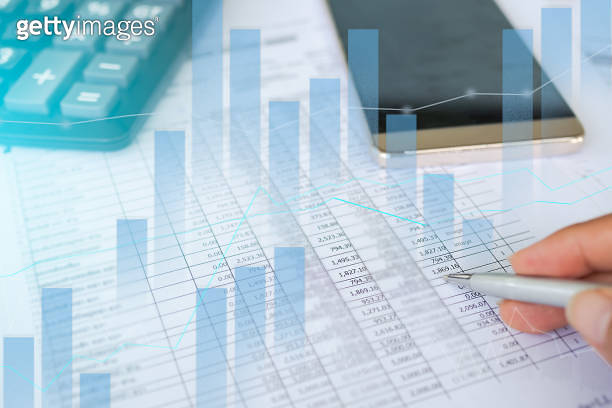 Bar graph stock market, forex trading with pen, calculator, smartphone ...