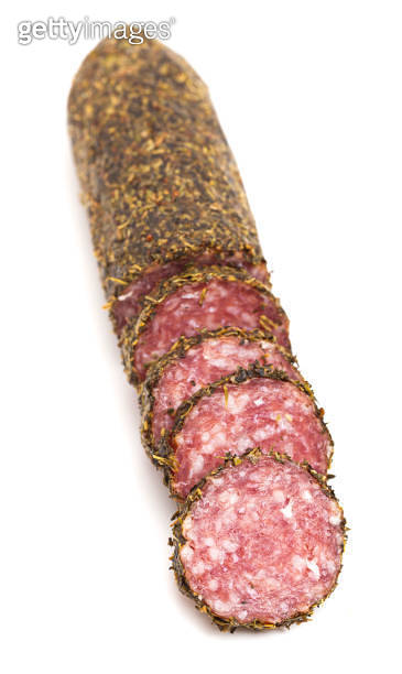A Log of Salami Coated in Herbs and Isolated on a White Background ...