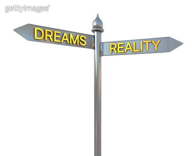Reality versus dreams. Road sign with words reality and dreams ...