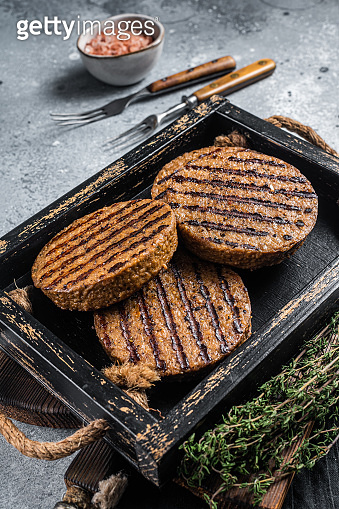 Roasted meat free patties, plant based meat burger cutlets in wooden ...