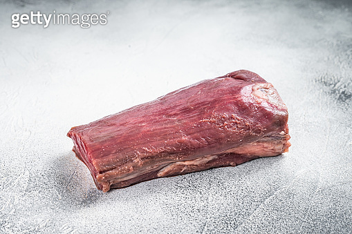 Beef Tenderloin raw meat on butcher table. White background. Top view ...