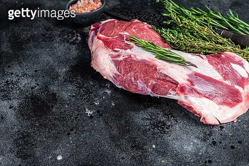 Fresh Raw lamb mutton shoulder meat with butcher knife. Black ...