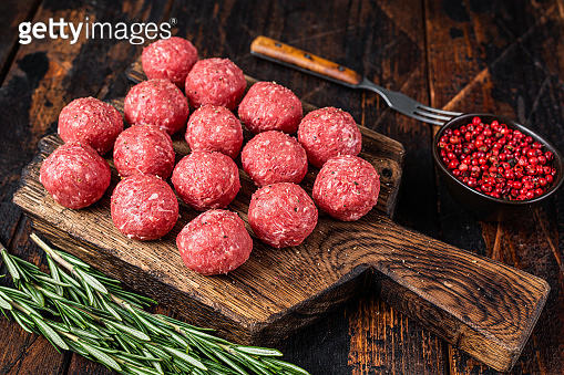 Uncooked Raw meatballs from ground beef and pork meat with rosemary ...
