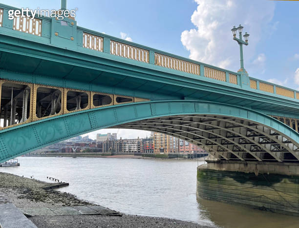 Thames Embankment under Southwark Bridge in scenes of summer London ...