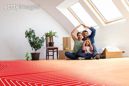 Home, people, moving and floor heating concept - portrait of happy ...