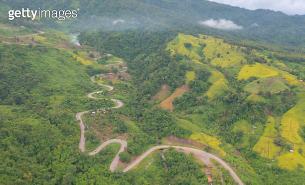 Aerial view of cars driving on curved, zigzag curve road or street on ...