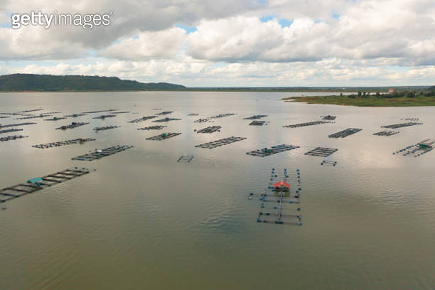 Aerial view of local fishing trap net in canel with fisherman home ...