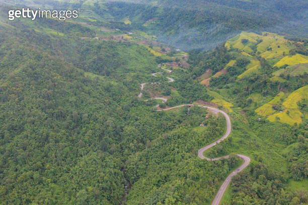 Aerial view of cars driving on curved, zigzag curve road or street on ...