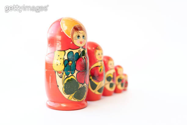 Matryoshka doll set in a row isolated. A symbol of the feminine side of ...