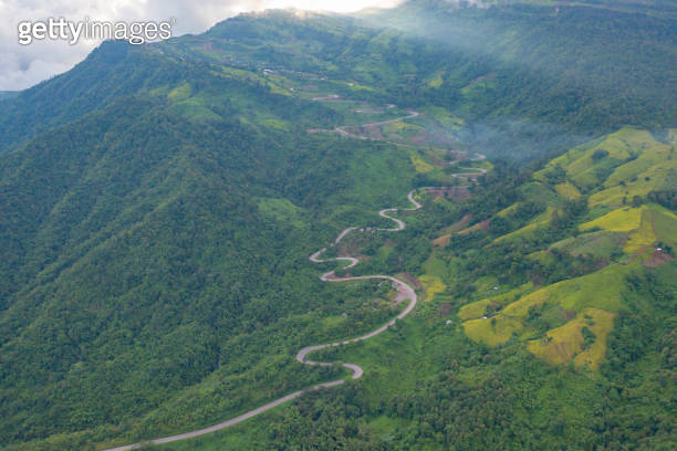 Aerial view of cars driving on curved, zigzag curve road or street on ...