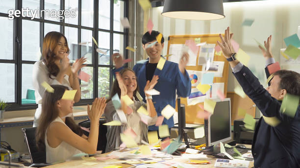 A successful group of multi ethnic business team employee have a ...