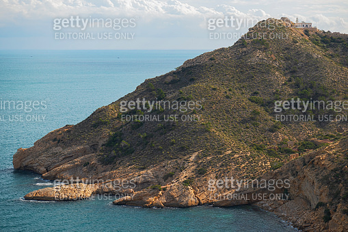 Sierra Helada natural park with Albir lighthouse located on top of a ...