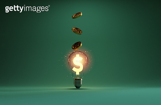 Golden US dollar sign glowing inside transparent lightbulb with coins ...