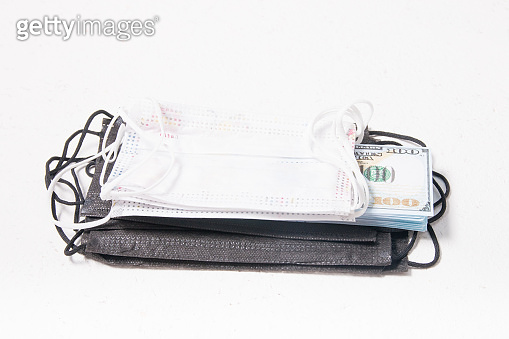 medical protective masks for children and adults and a stack of 100 ...