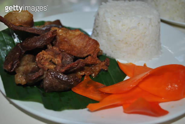 Popular Philippine breakfast of rice, tocino or sweeted cured beef, and ...