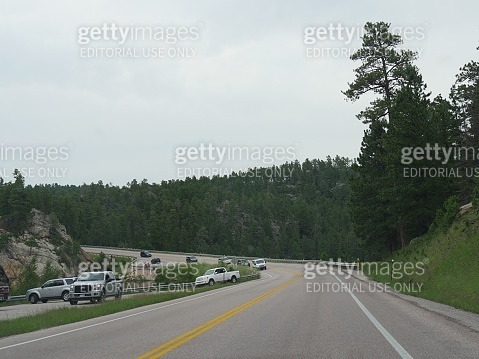 Vehicles park along the road to view scenic attractions at Keystone ...