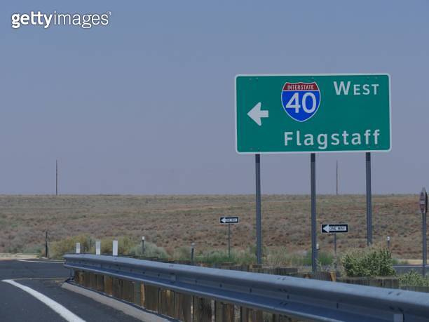 Directional roadside sign at Interstate 40 with an arrow to Flagstaff ...
