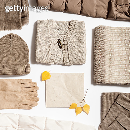 Autumn warm clothes flat lay, knitted hat, wool scarf and suede gloves ...