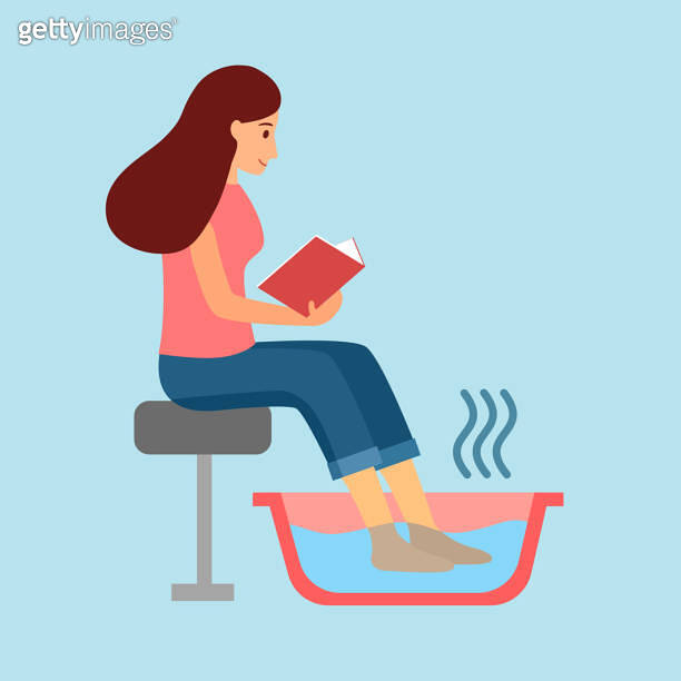 Female soaking feet in bowl filled with warm water at home or spa in ...