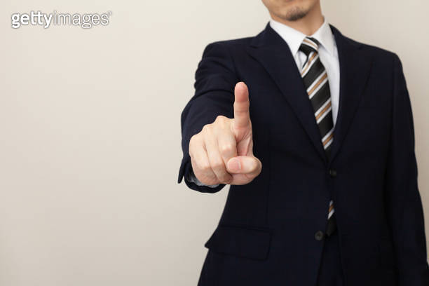 A male hand that operates the touch panel with the thumb and index ...