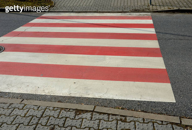 crossing the road, white red zebra for better visibility and safety in ...