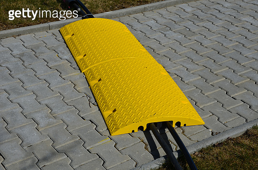 connecting electricity cables through walking paved sidewalk road. a ...